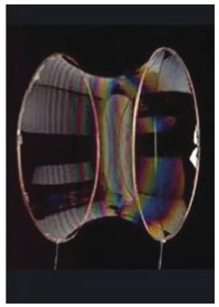Small symmetrical deformation and stress analysis of catenary shells of ...