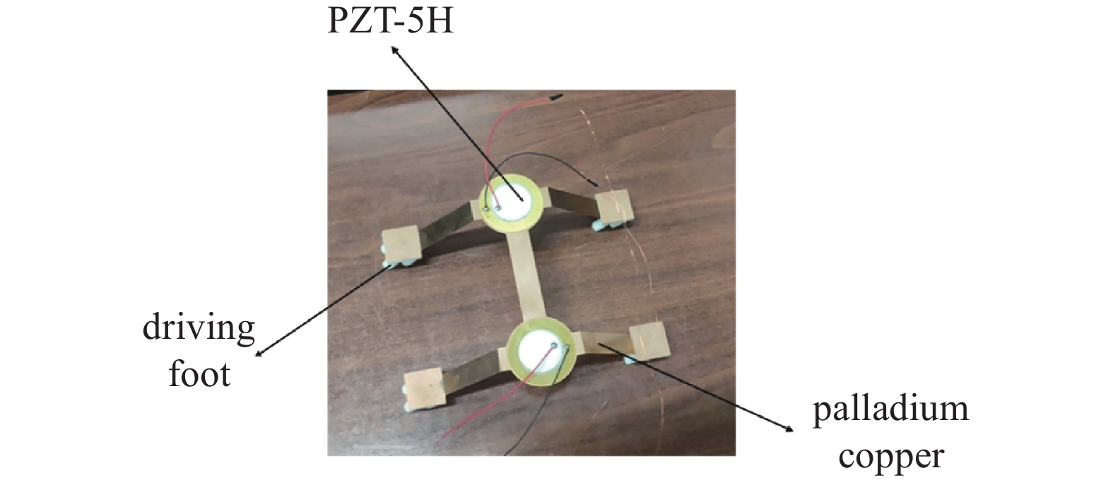 DESIGN AND EXPERIMENT OF A RESONANT PIEZOELECTRIC CRAWLING ROBOT